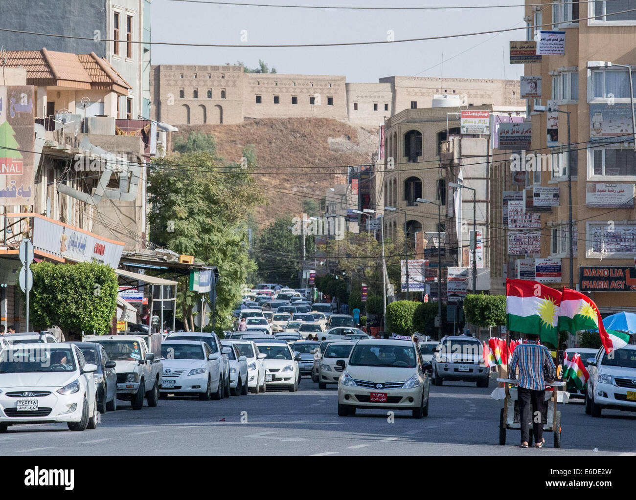 Busy traffic rushes past the citadel in Erbil, Iraq, 16 August 2014 ...