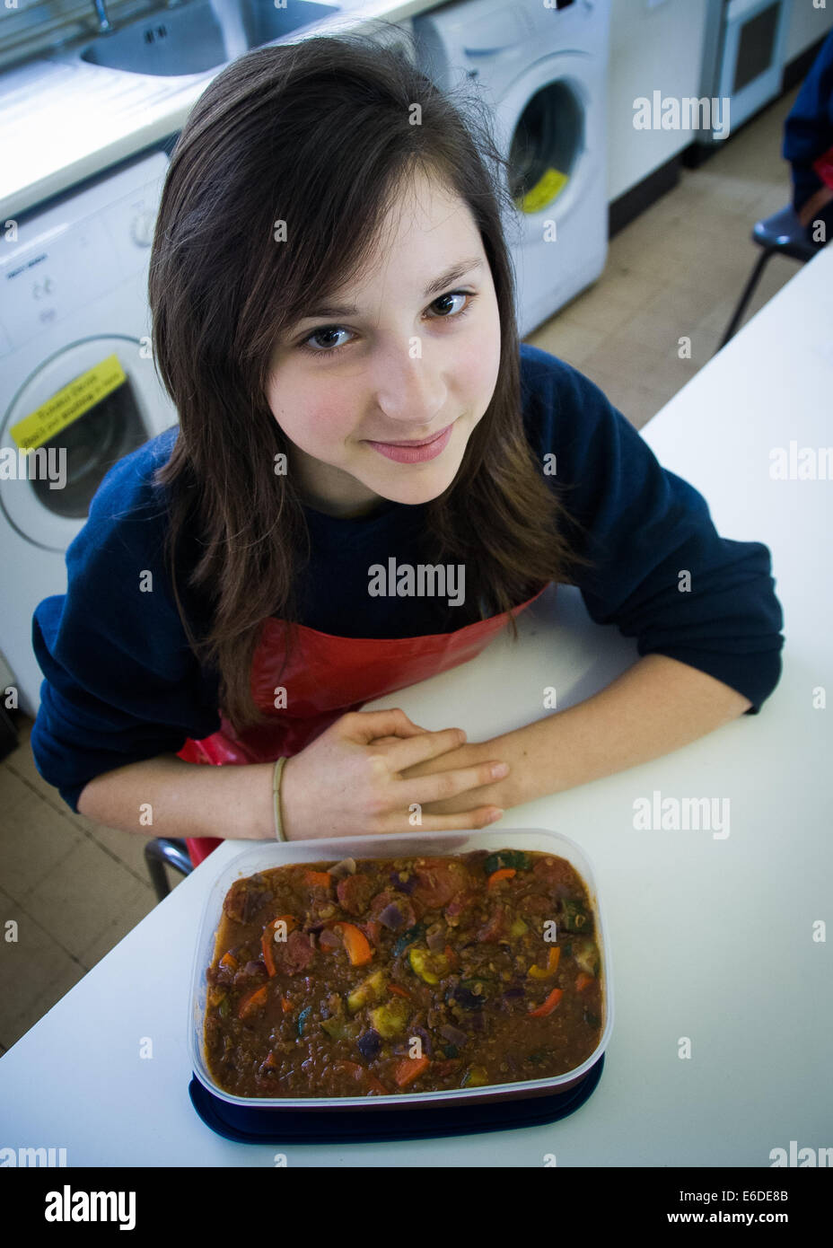 Girl with her dish at cooking lesson at Secondary School in Cirencester ...
