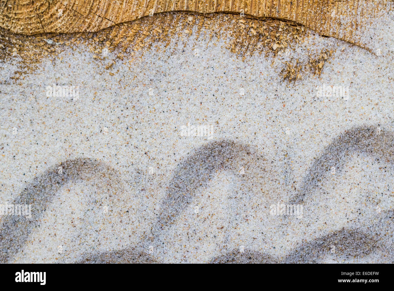 Marine background with sand spilled on a wooden table Stock Photo - Alamy