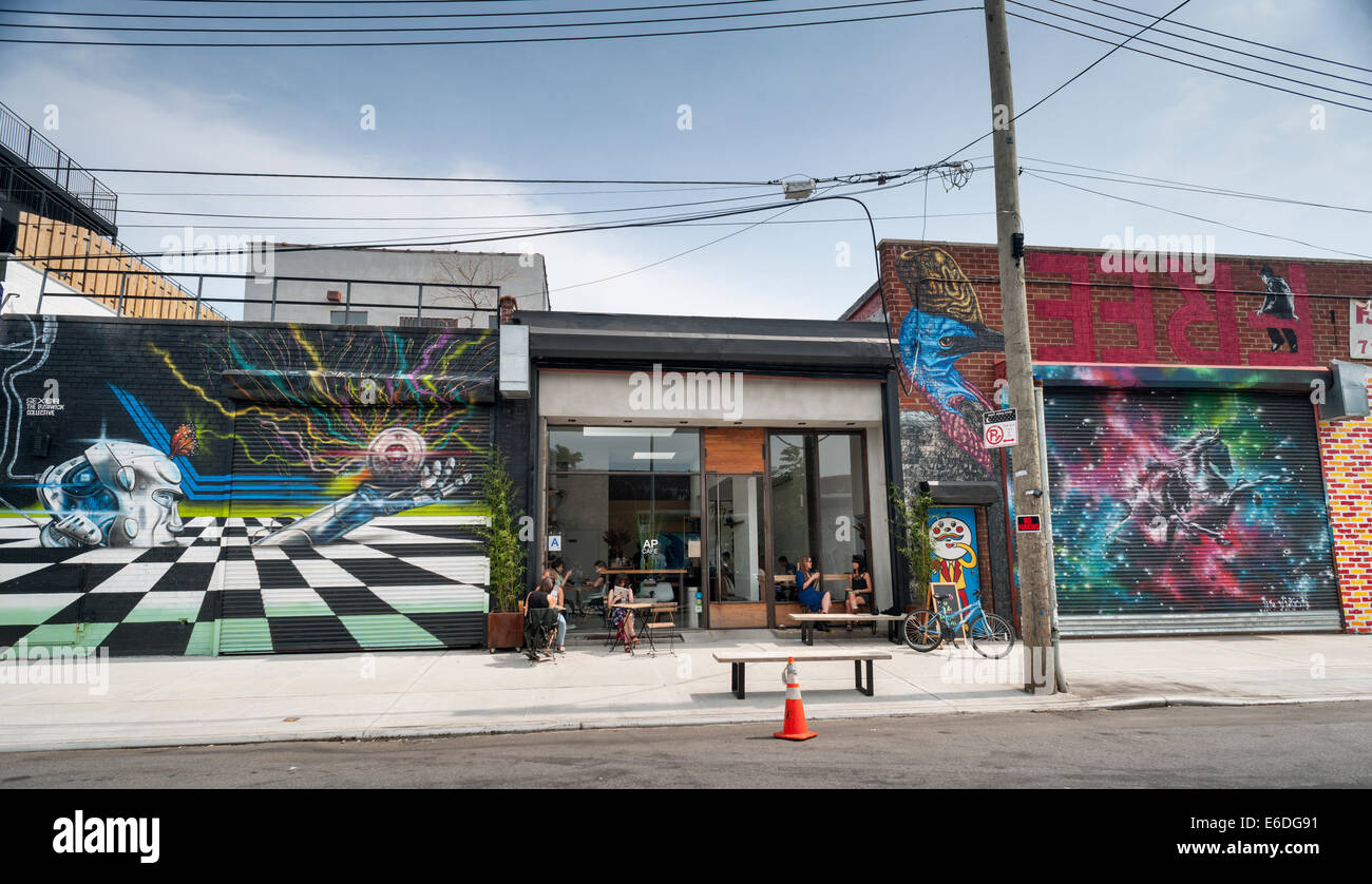 A coffee shop sandwiched between two Bushwick Collective murals in the ...