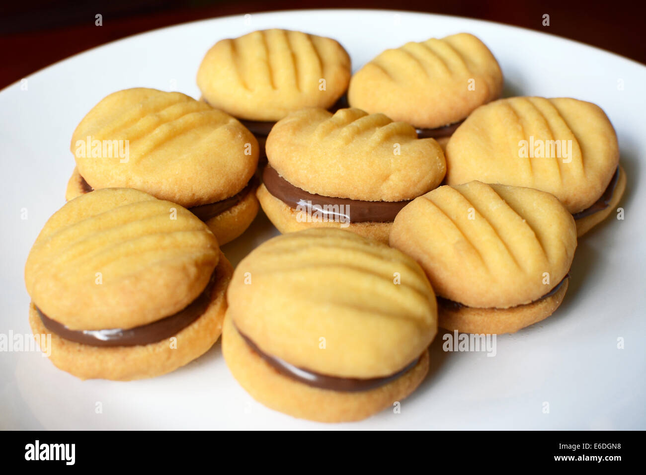Plate of shortbread yo-yo cookies with chocolate filling Stock Photo ...