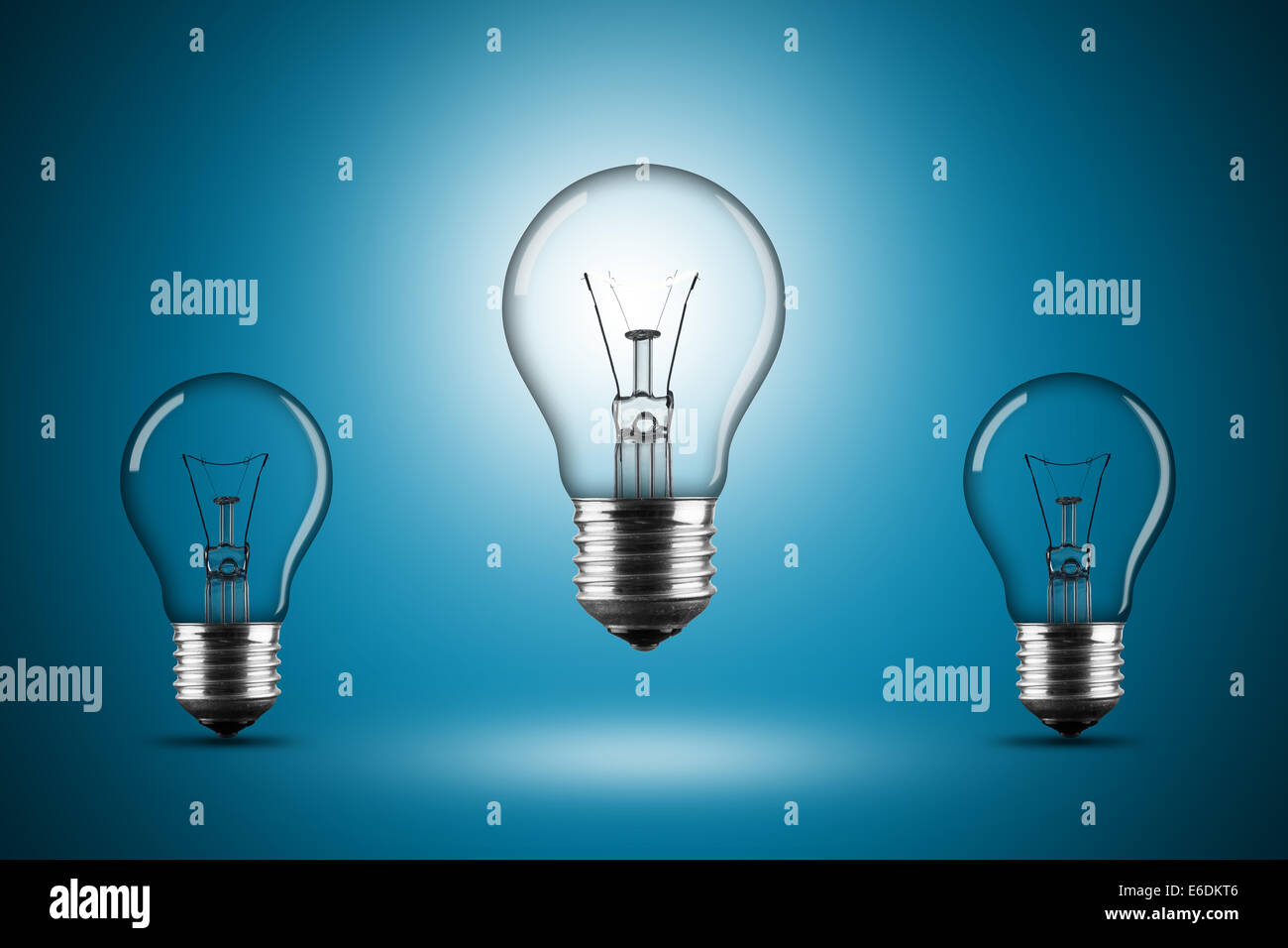 row of light bulbs on blue background Stock Photo - Alamy