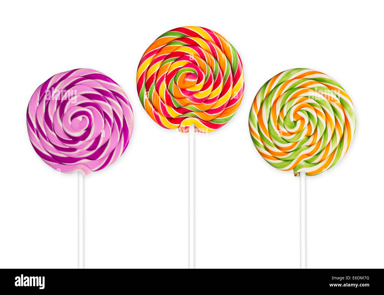 three lolly pops in front of white background Stock Photo - Alamy