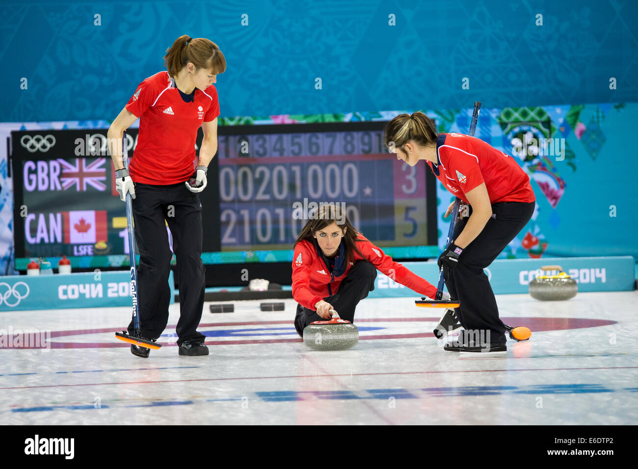 Eve Muirhead (C) of Team Great Britain plays a stone with Claire ...