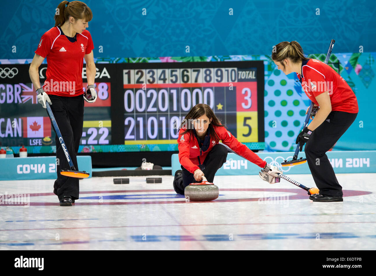 Eve Muirhead (C) of Team Great Britain plays a stone with Claire ...