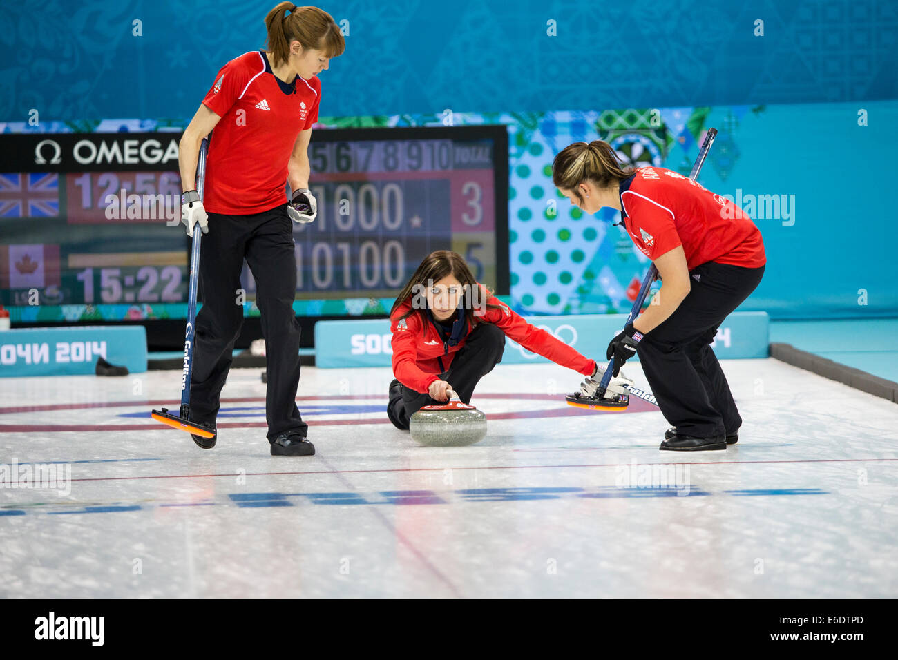 Eve Muirhead (C) of Team Great Britain plays a stone with Claire ...