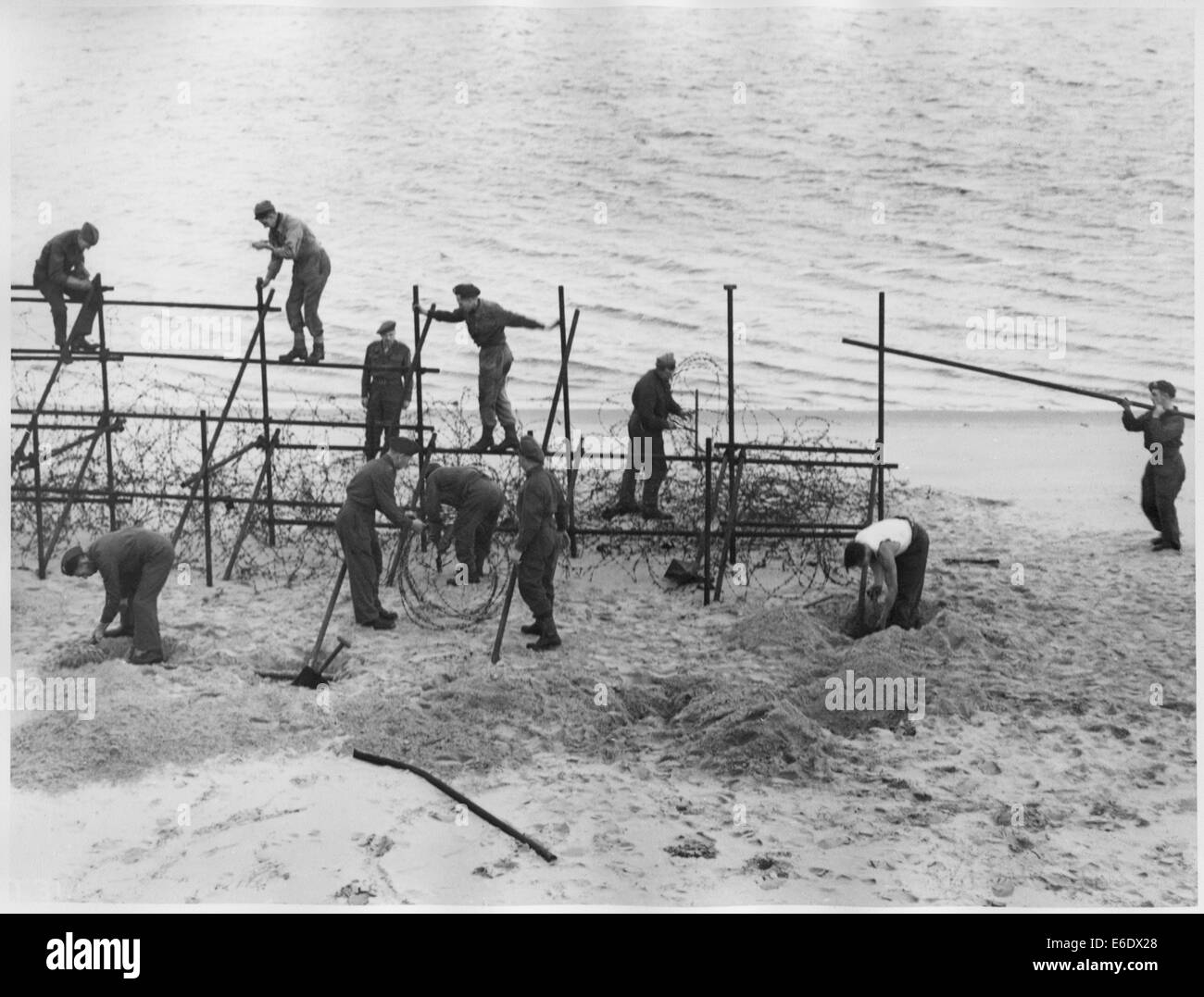 WWII Soldiers Constructing Barricade on Beach, from the British ...