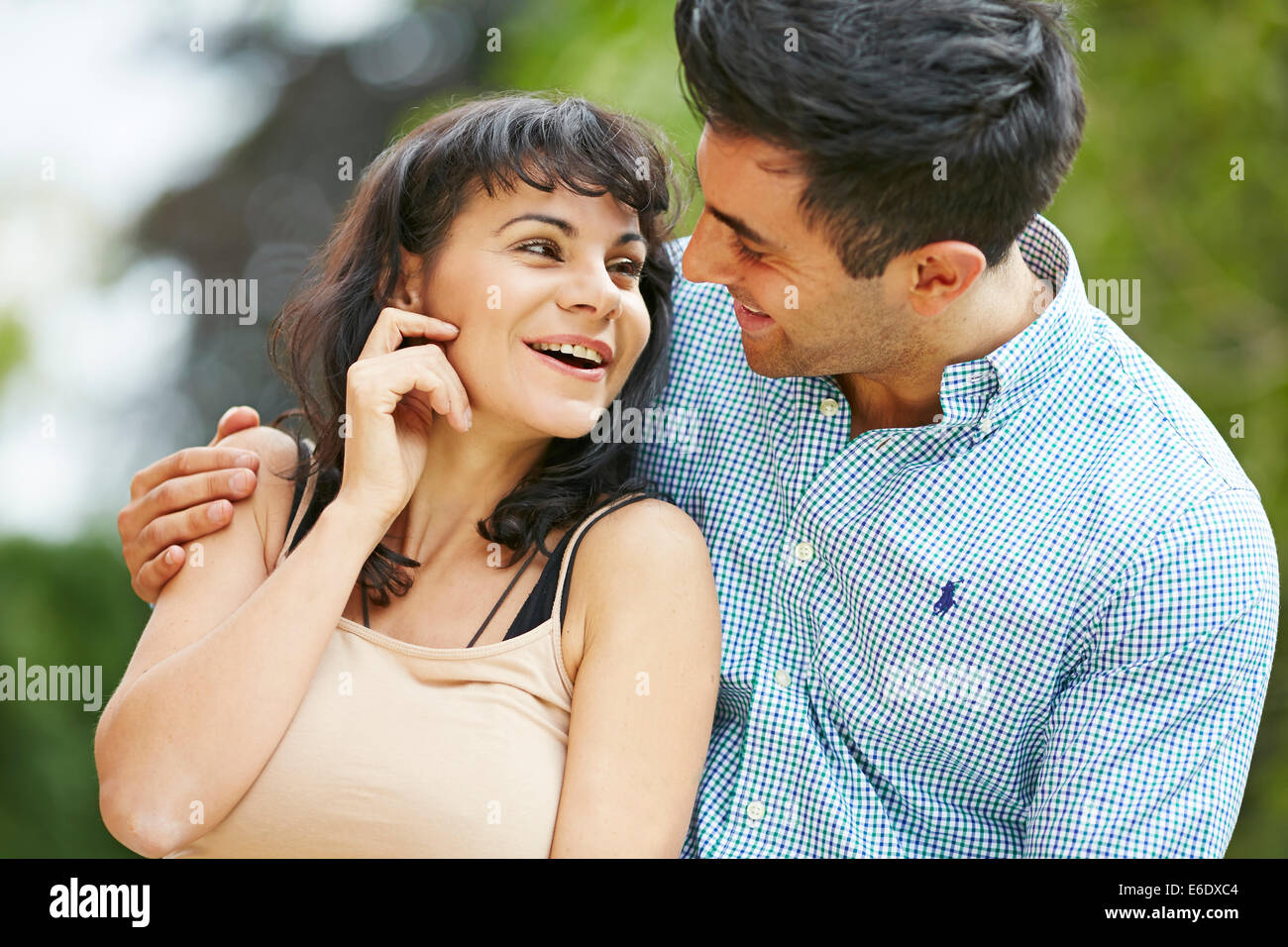 Happy couple walking outdoors Stock Photo - Alamy