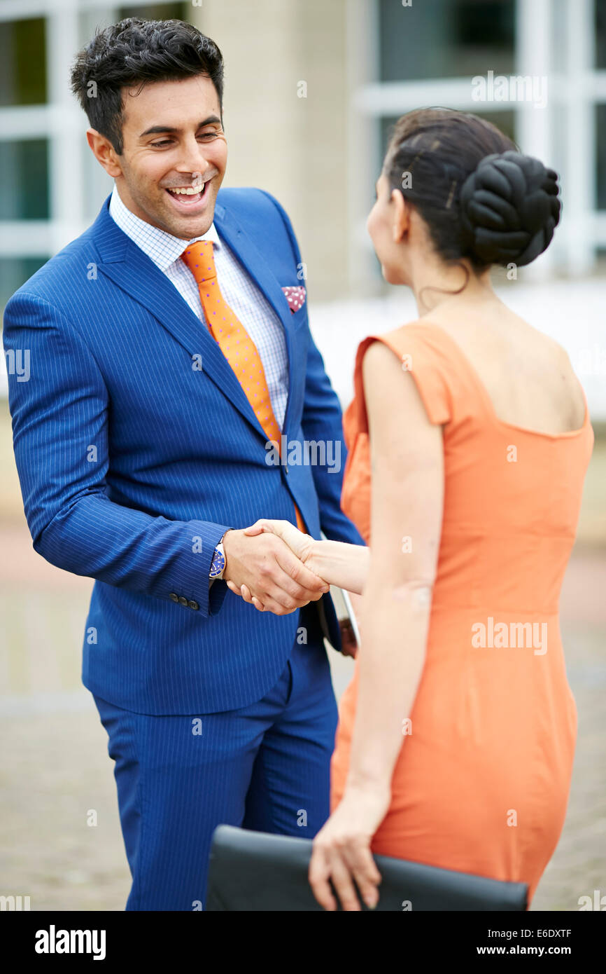Two business people greeting Stock Photo - Alamy