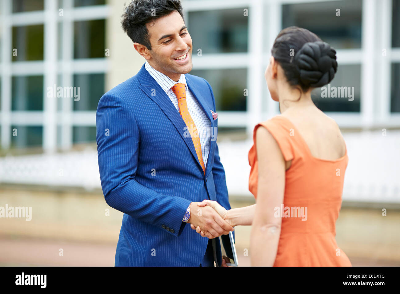 Two business people greeting Stock Photo - Alamy