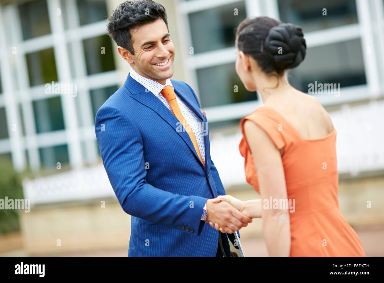 Two business people greeting Stock Photo - Alamy