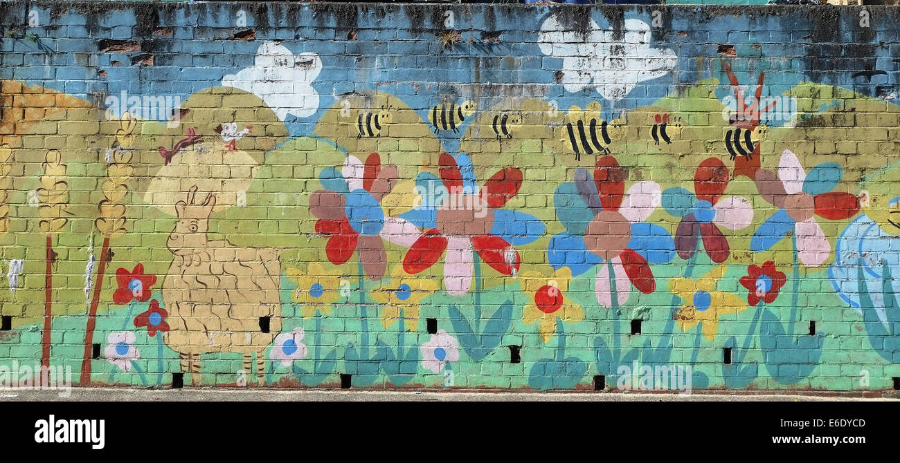 old and deteriorating wall art at a school in south Wales Stock Photo ...