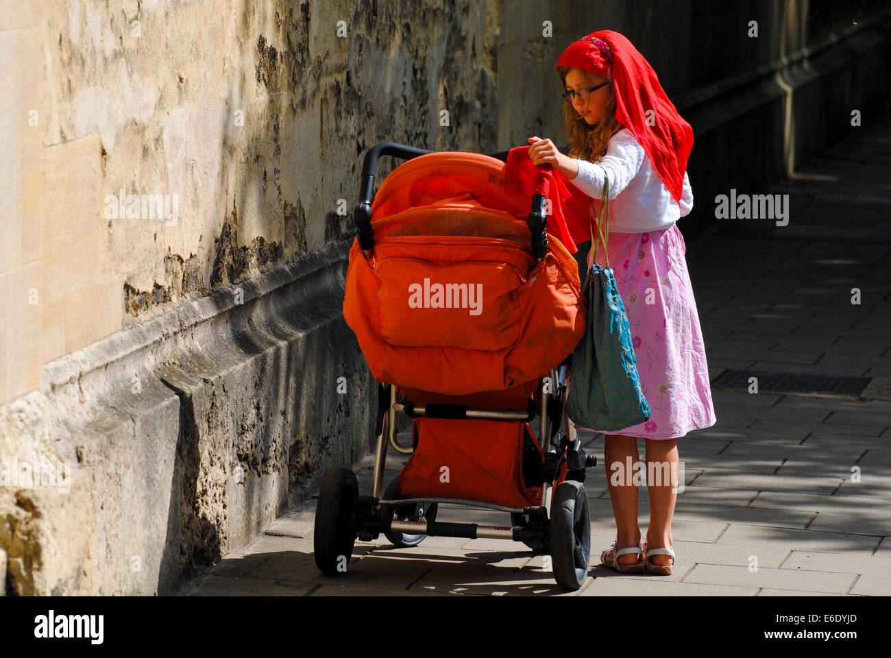 Young girl with a pram Stock Photo - Alamy