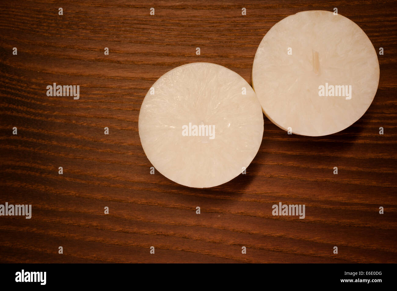 two tea lights on a wood background Stock Photo - Alamy