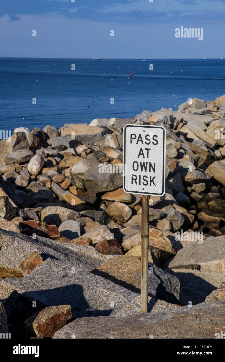 Pass at own risk sign Stock Photo - Alamy