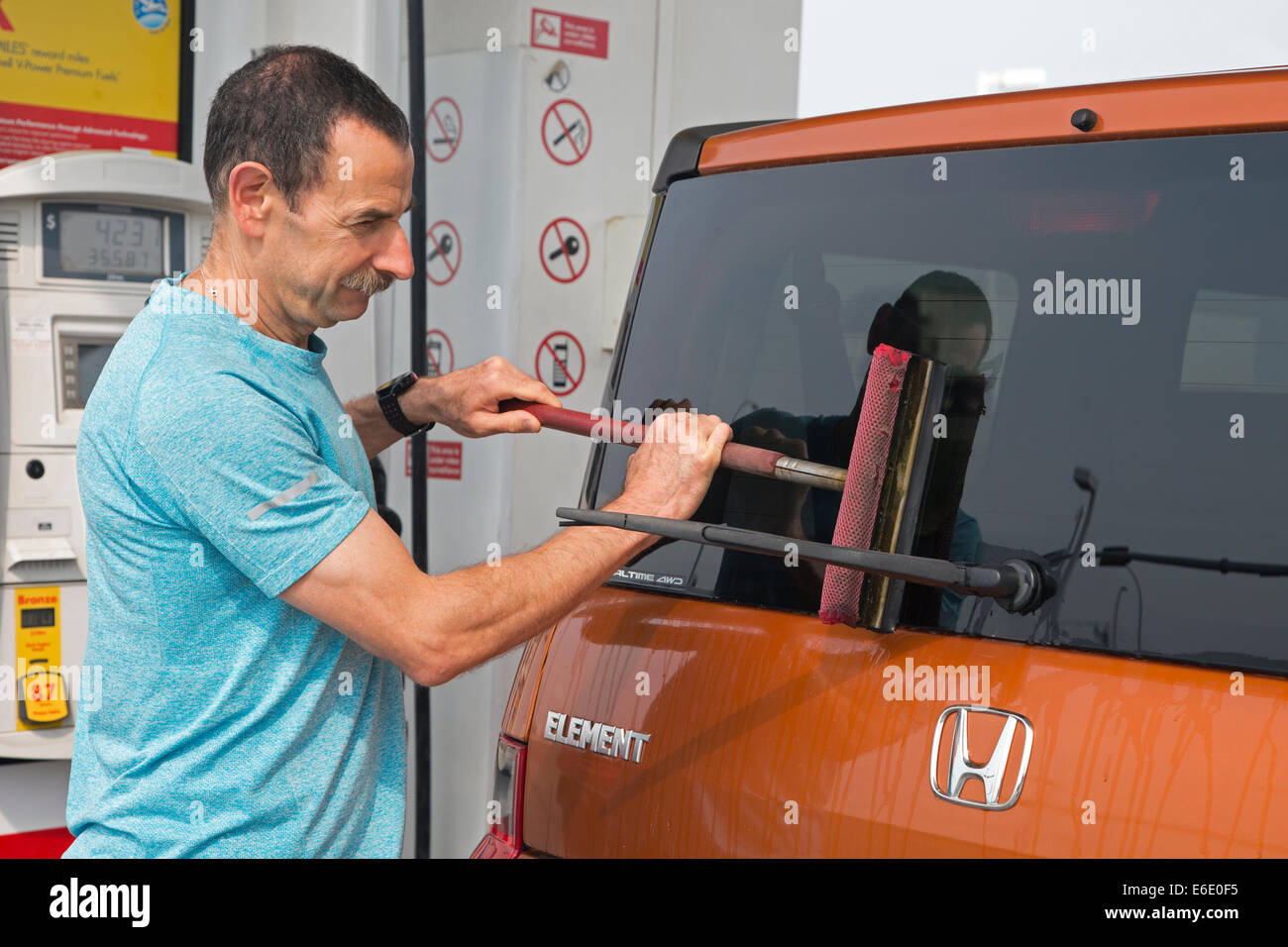 Man washing vehicle windshield service hi-res stock photography and ...