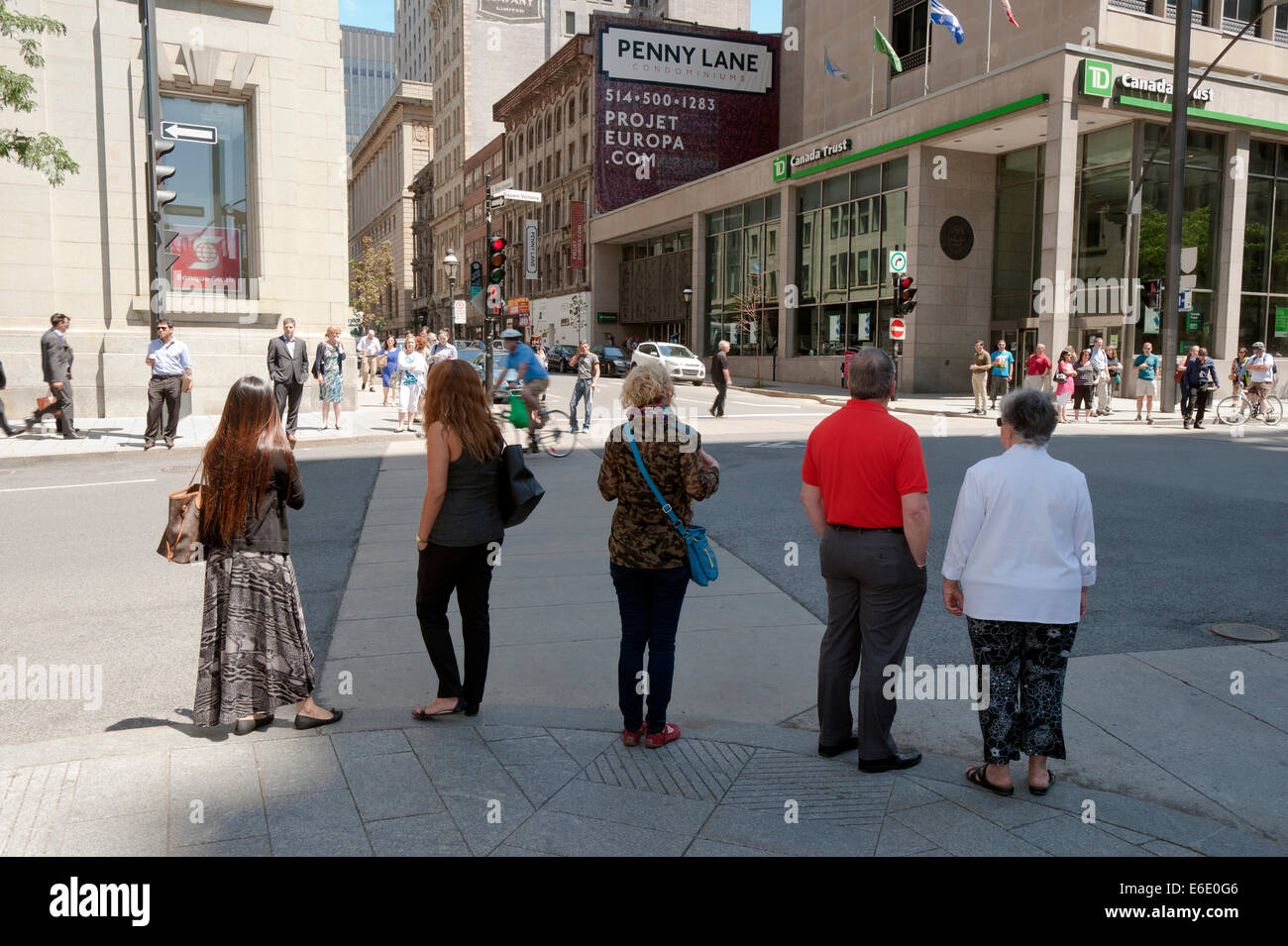 People waiting to cross the street in downtown Montreal, province of ...