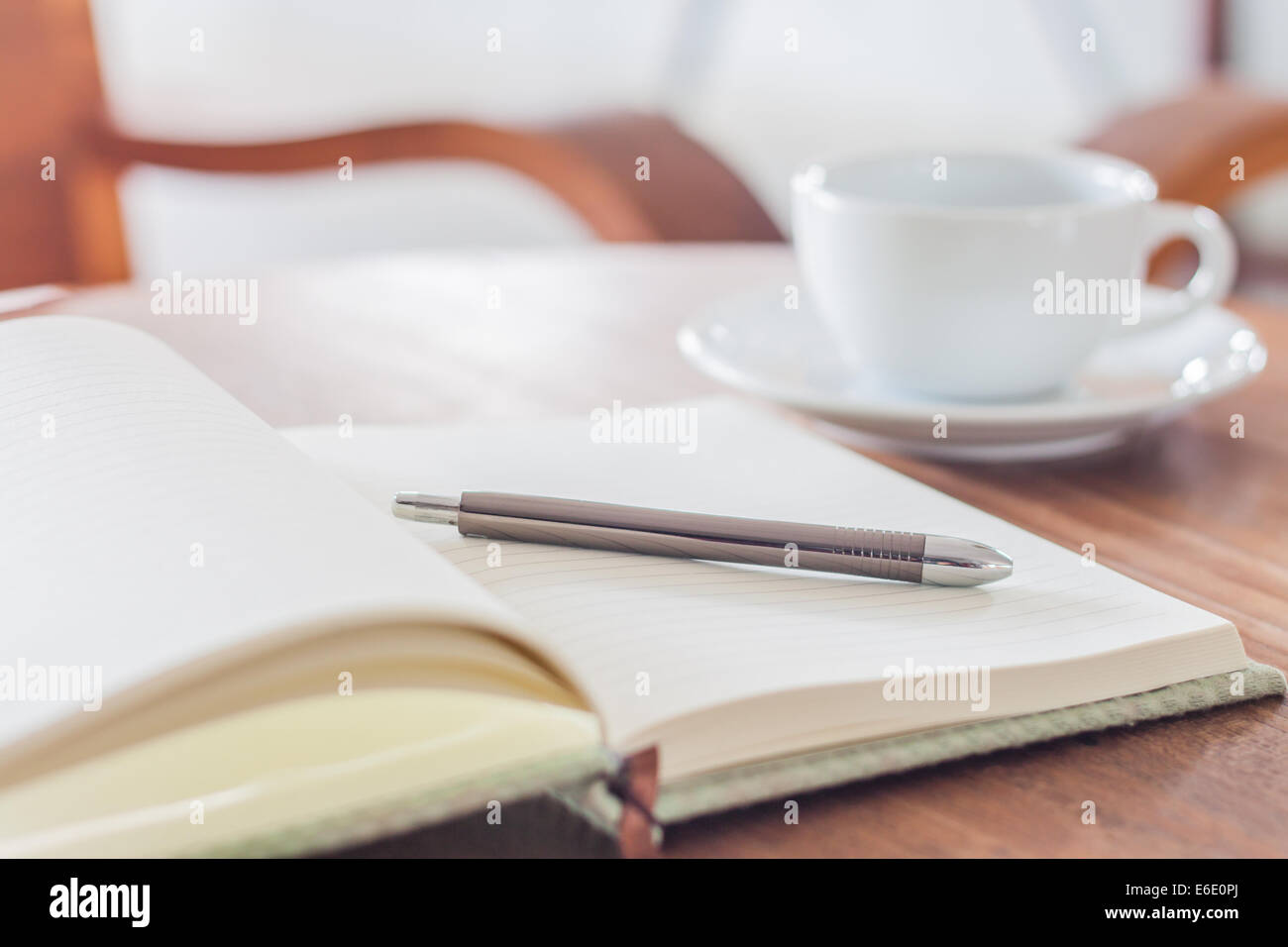 Notebook and pen with coffee cup, stock photo Stock Photo - Alamy