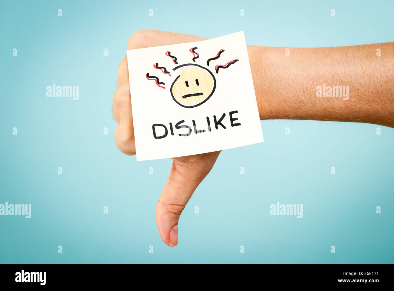 Dislike concept with hand on blue background Stock Photo - Alamy