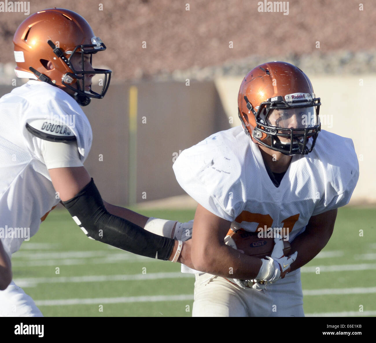 USA. 21st Aug, 2014. Eldorado's Noah Sweitzer gets the hand off from ...
