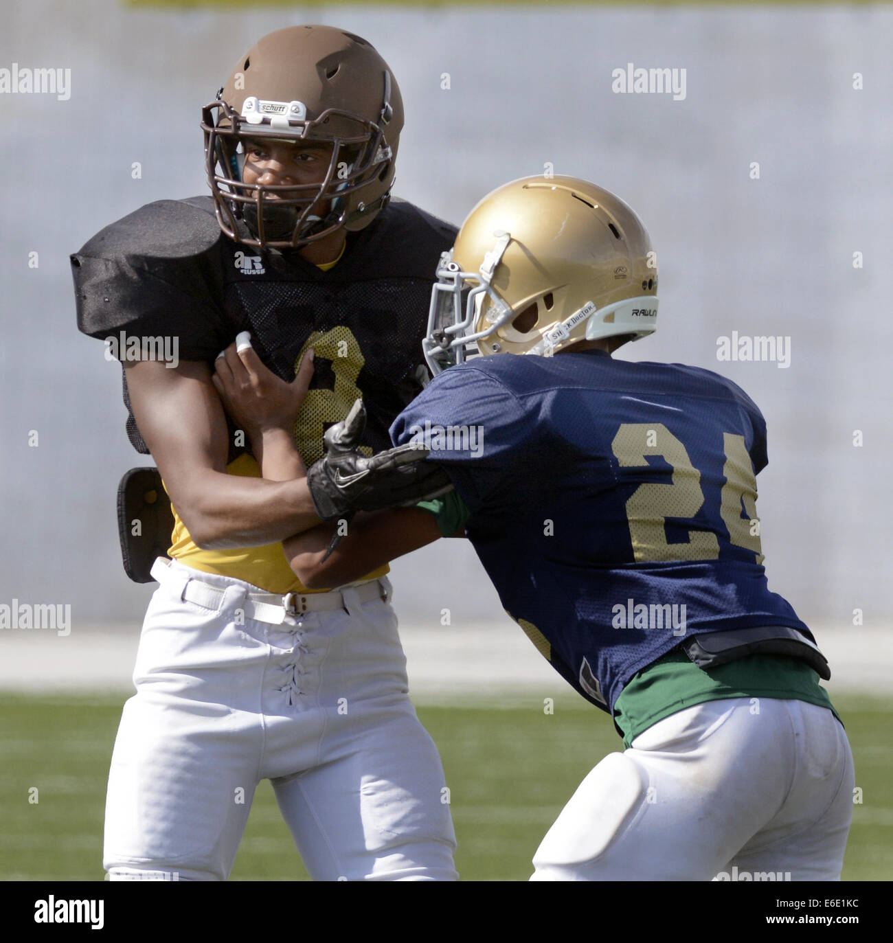USA. 21st Aug, 2014. Cibola cornerback Blair Manly battles with Atrisco ...