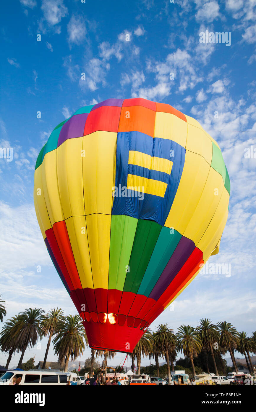 Hot air balloon lifting off just after sunrise Stock Photo - Alamy