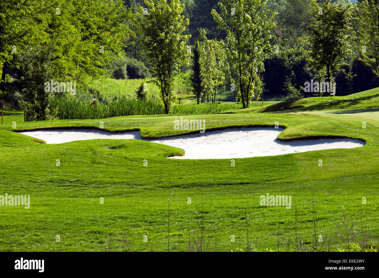 Golf field with bunker Stock Photo - Alamy
