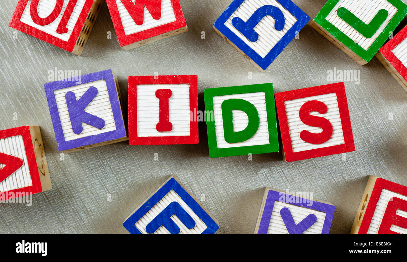 Wooden blocks forming the word KIDS in the center Stock Photo - Alamy