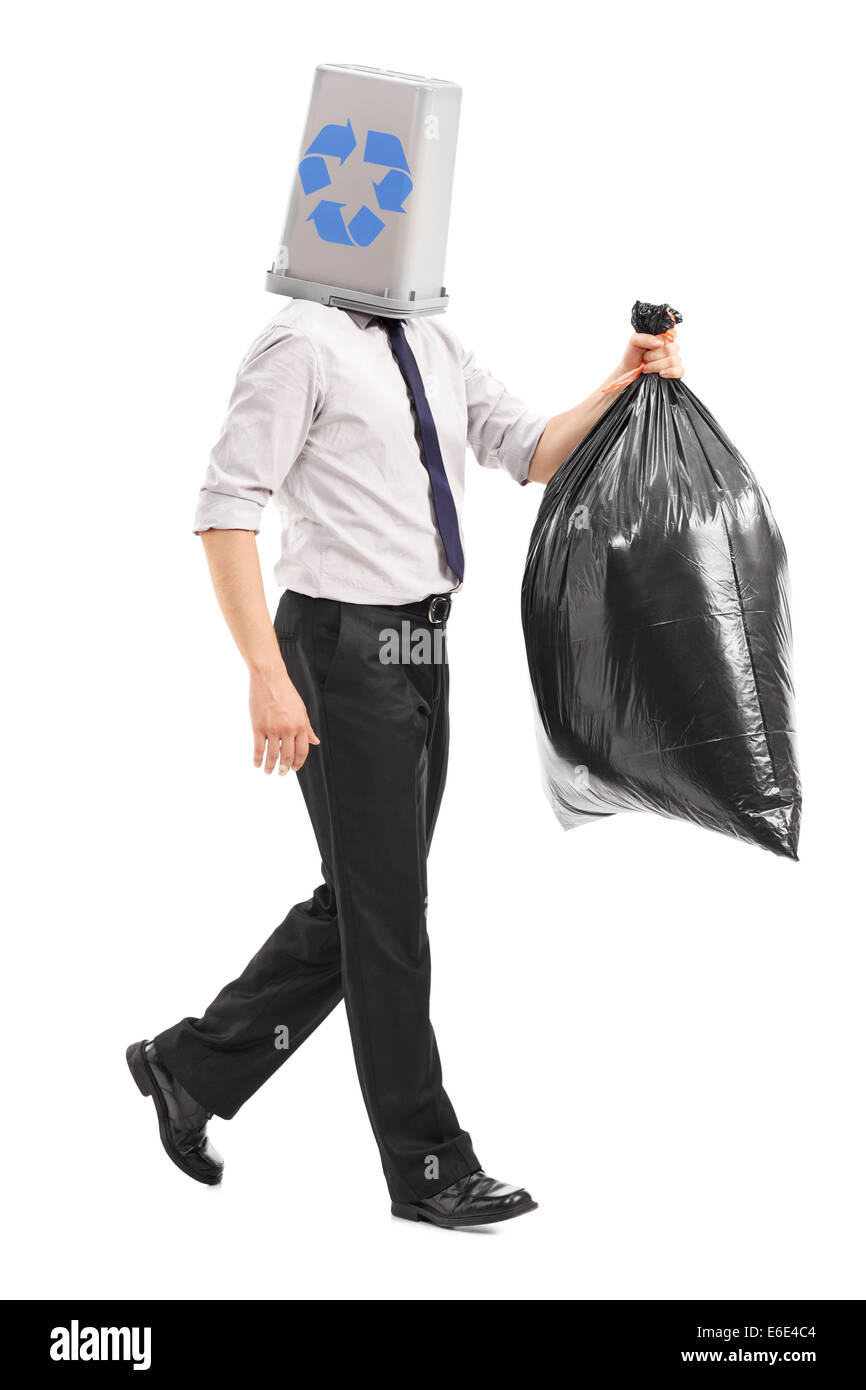 Full length portrait of a man with a recycle bin over his head carrying ...
