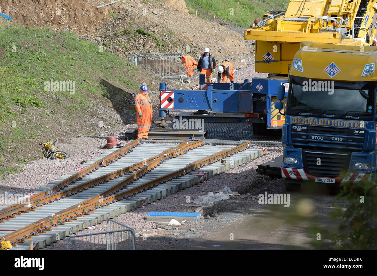 Galashiels, UK. 21 Aug 2014. Laying of test rail track at Tweedbank ...