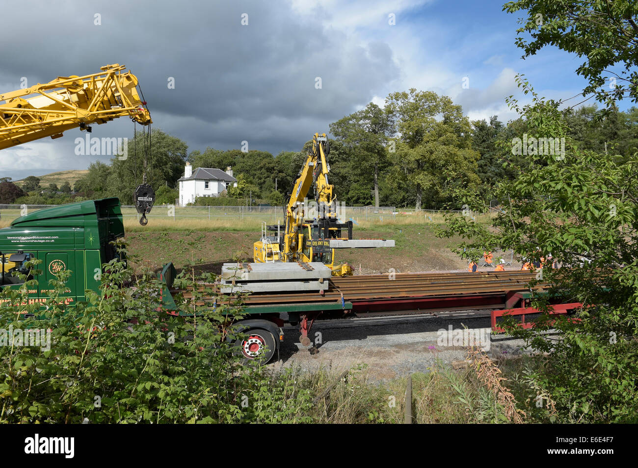 Galashiels, UK. 21 Aug 2014. Laying of test rail track at Tweedbank ...
