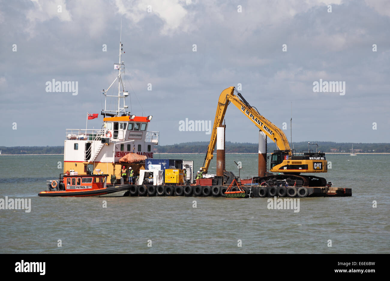 A dredging excavator mounted on a marine work barge in the Solent, part ...