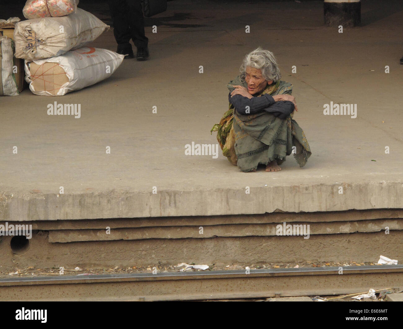 Old lady on the train station,life in passing lane Stock Photo - Alamy