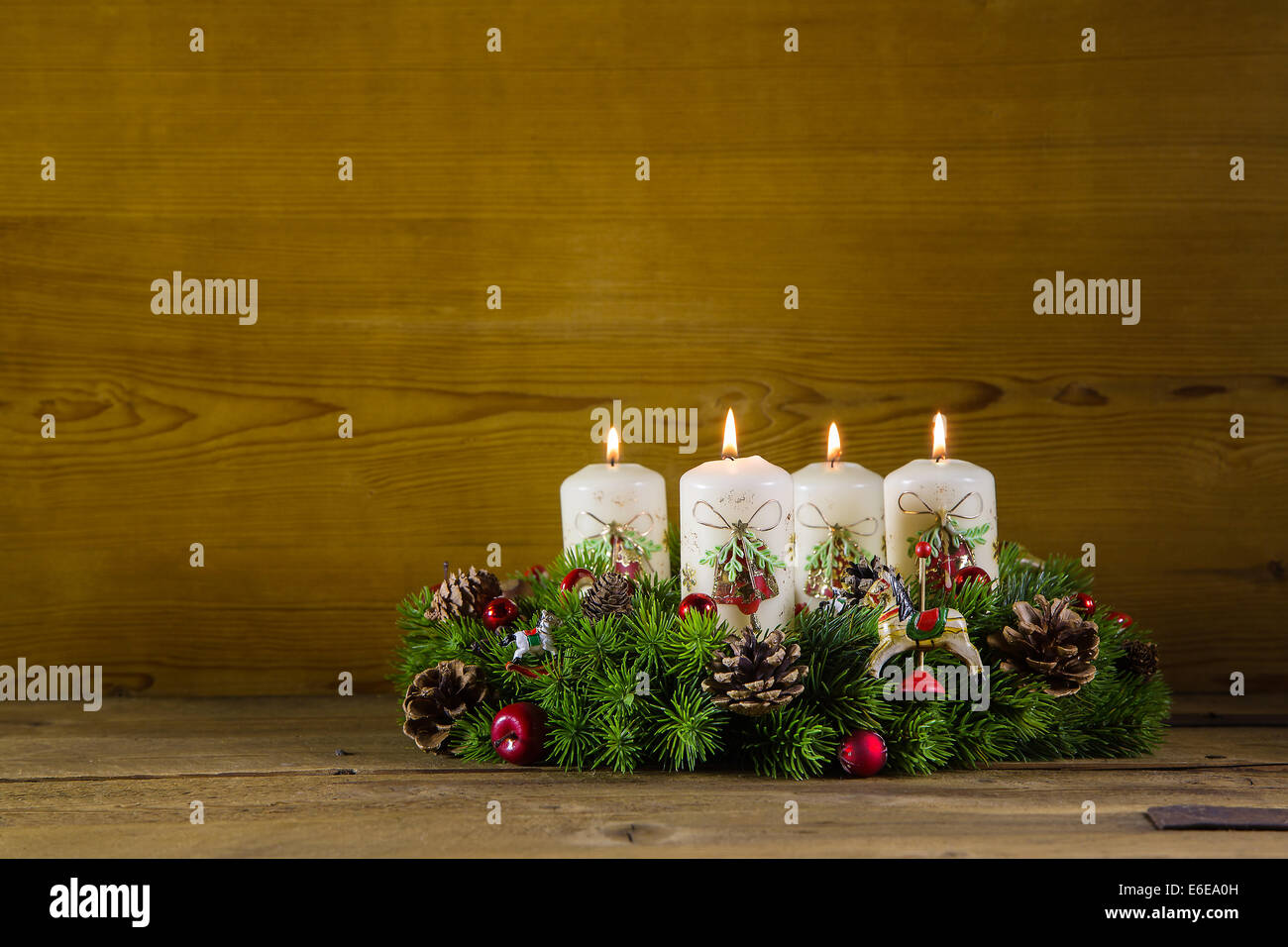 Natural advent wreath or crown with four burning white candles Stock ...