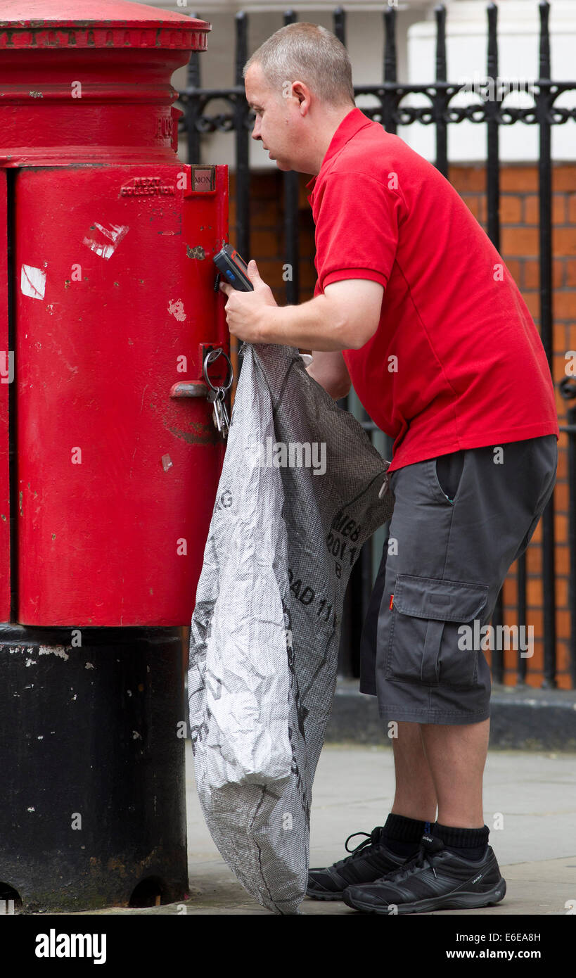 UK, London : A postman empties a postbox in London Stock Photo - Alamy