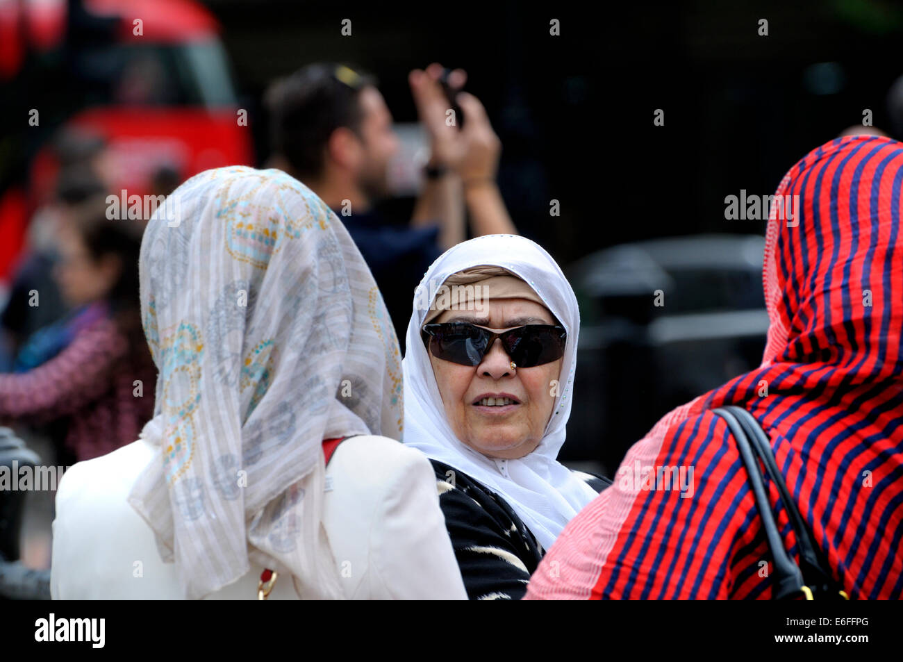London, England, UK. Muslim women in headscarves in Trafalger Square ...