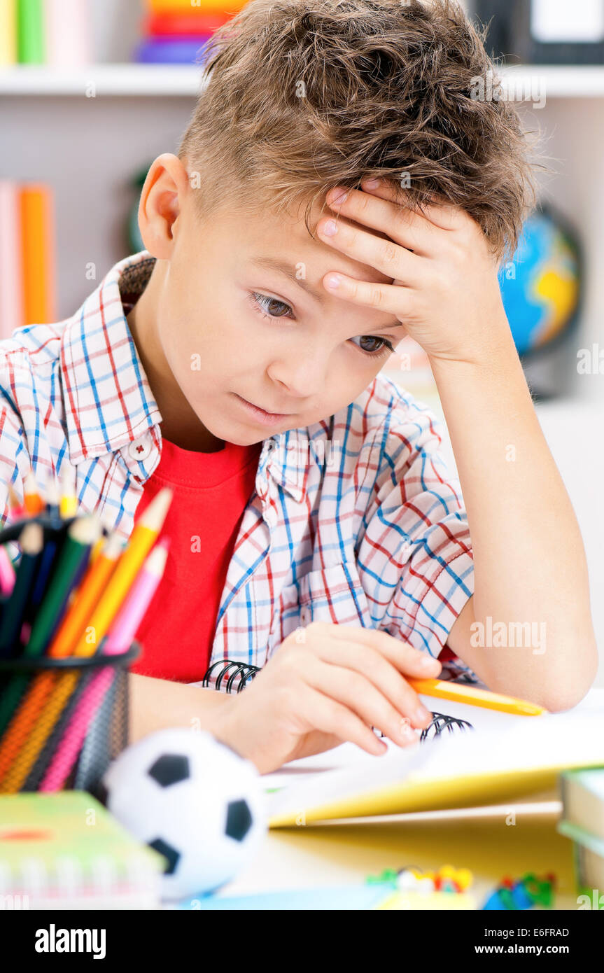 Boy doing homework Stock Photo - Alamy
