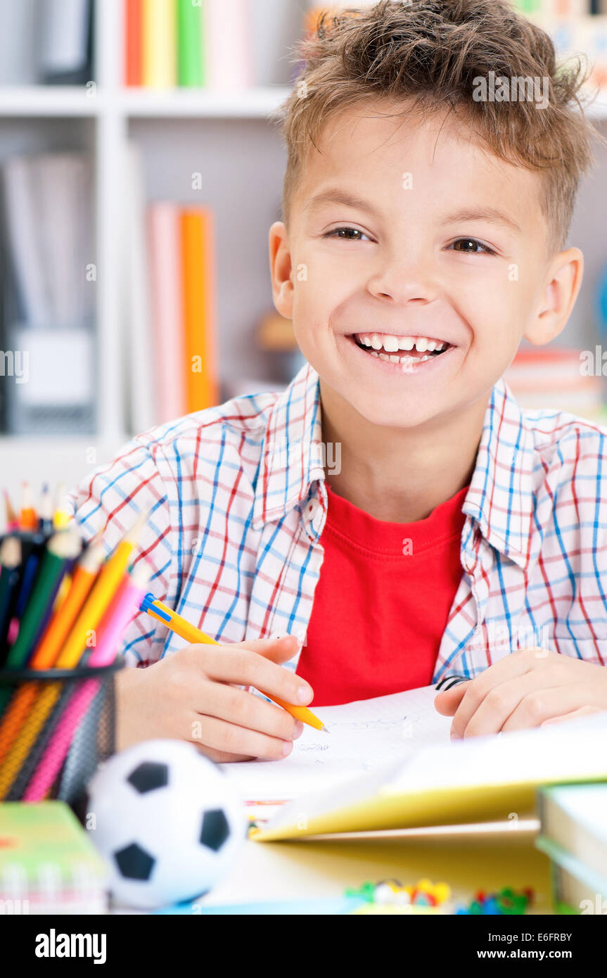 Boy doing homework Stock Photo - Alamy