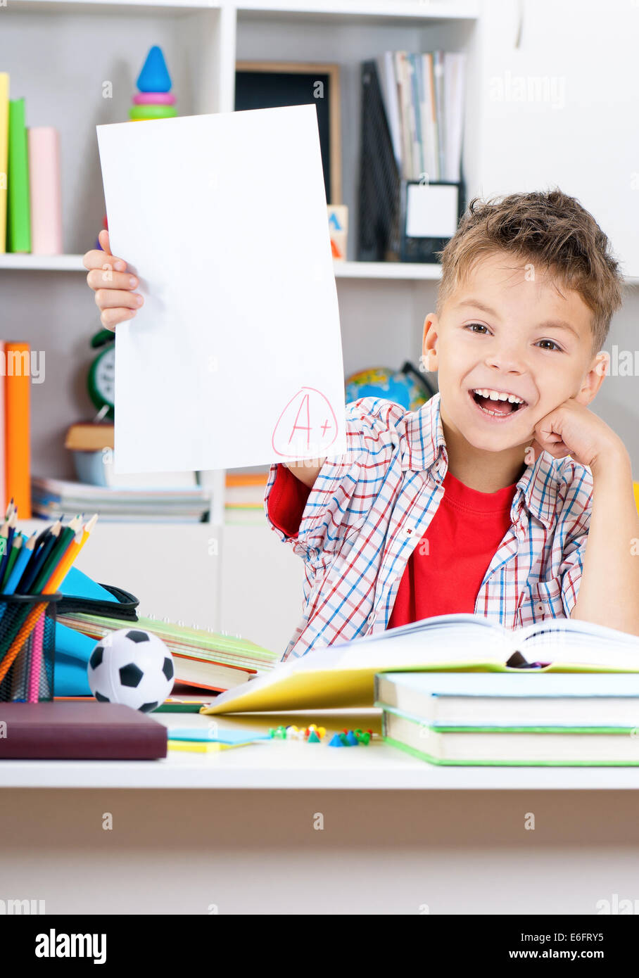 Boy doing homework Stock Photo - Alamy
