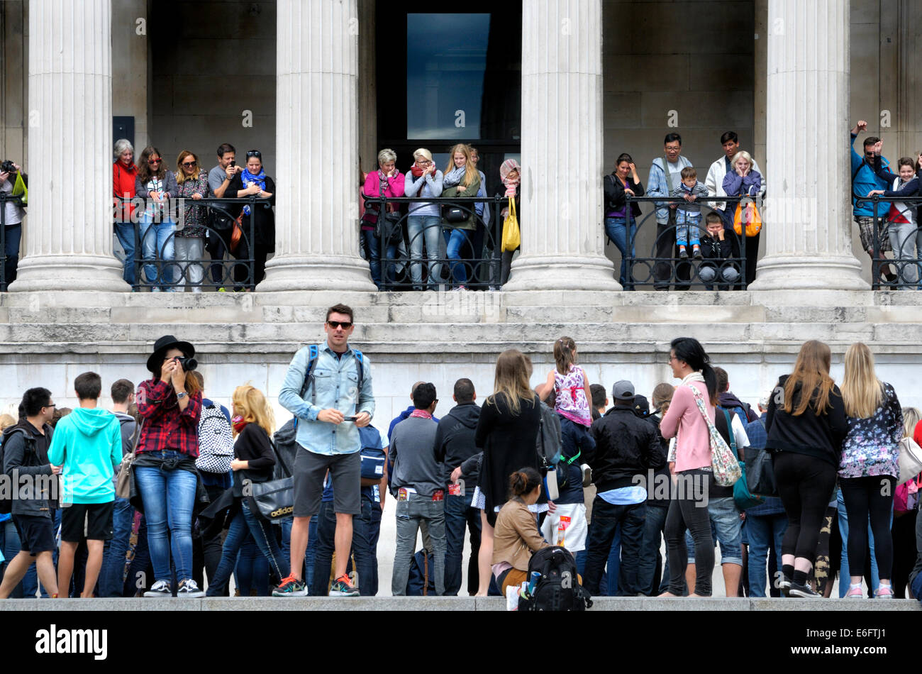 London, England, UK. People on the steps in Trafalgar Square and in the ...