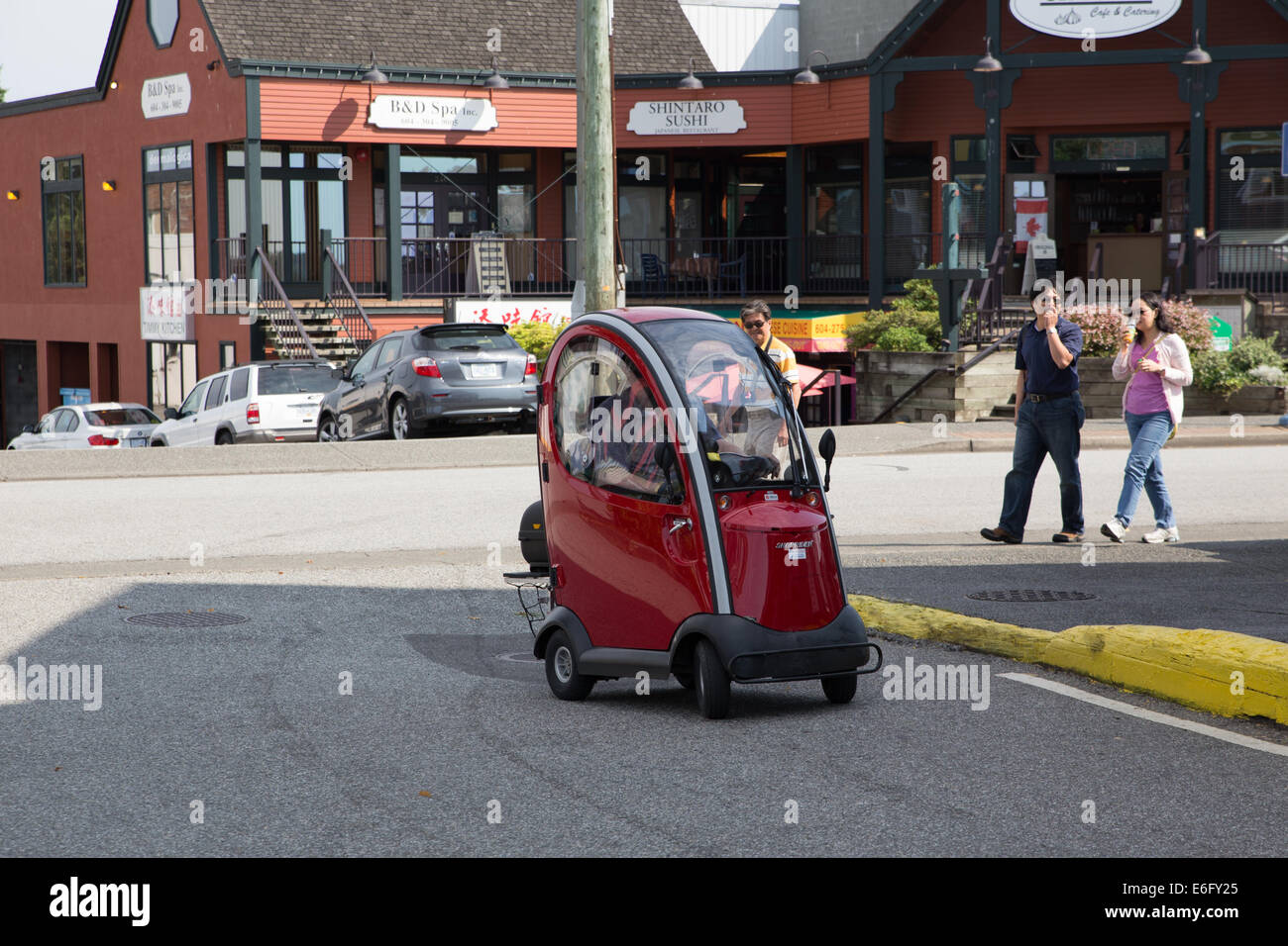 tiny single person electric car Stock Photo - Alamy