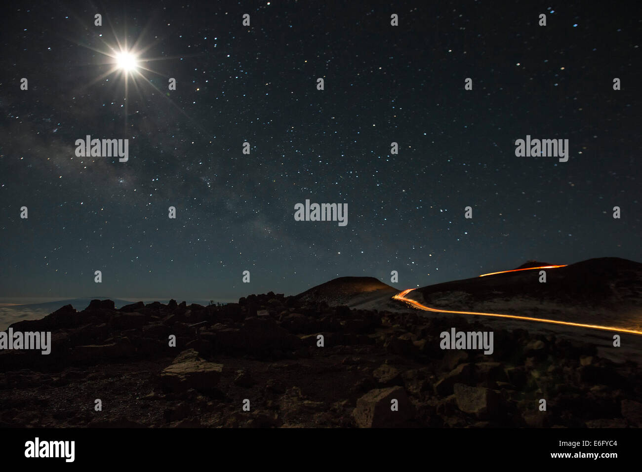 The Milky Way and Moon from the summit of Haleakala, Hawaii. Car tail ...