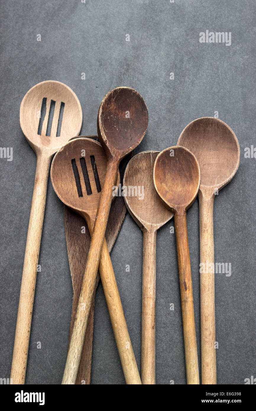 Large wooden mixing spoons on table, from above Stock Photo - Alamy