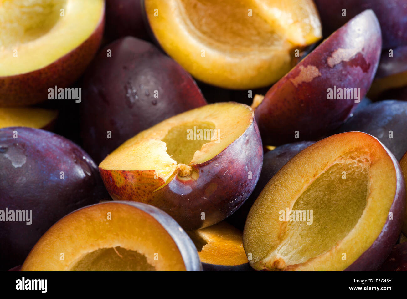 Background from many halved plum pieces Stock Photo - Alamy