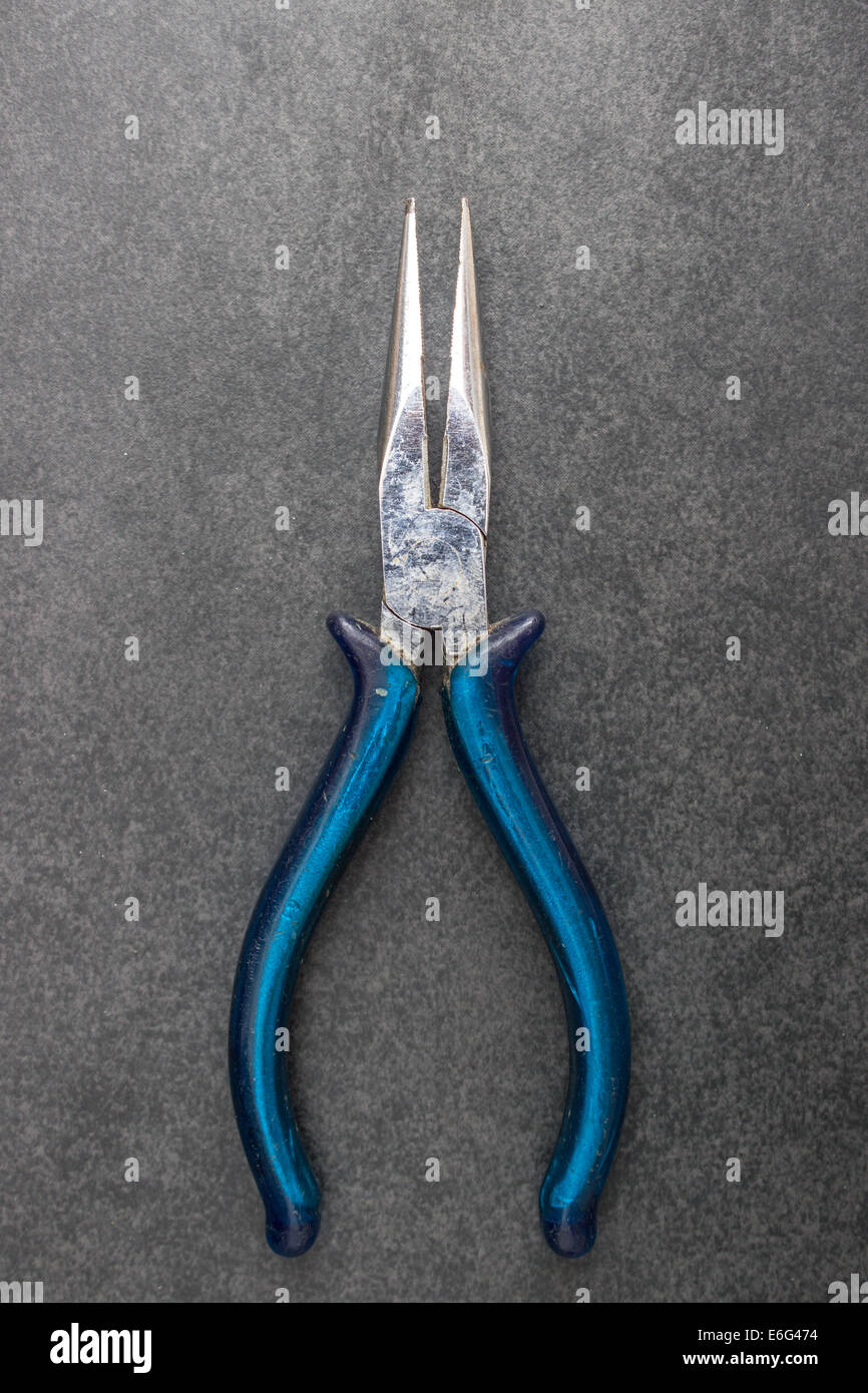 Old Used Pliers on Table , from above Stock Photo - Alamy