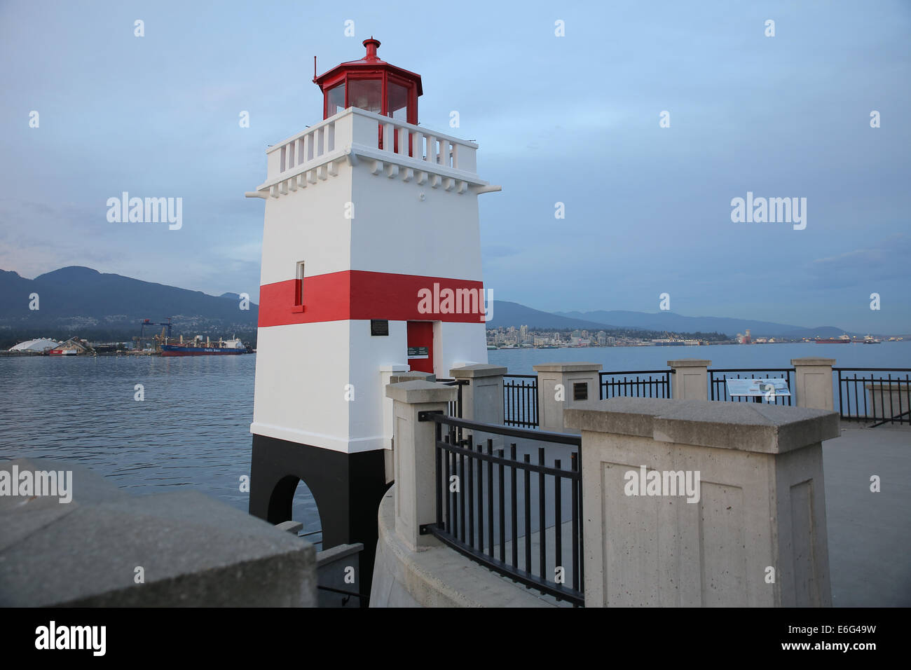 The red and white Brockton Point lighthouse overlooks Coal Harbour in ...