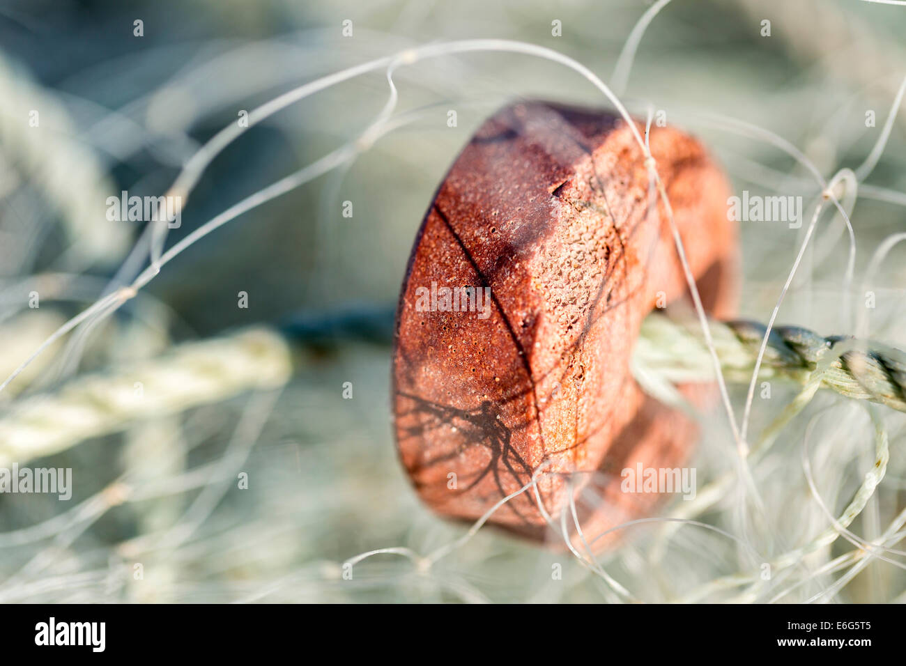 A closeup of a fishingnet with a float Stock Photo - Alamy