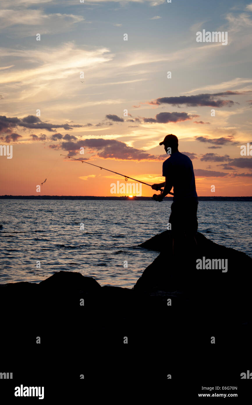 Fishing at Sunset Stock Photo - Alamy