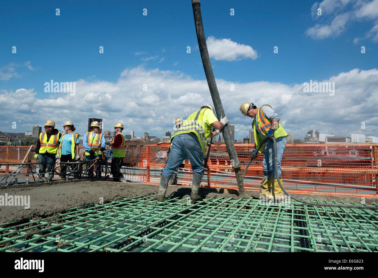 Workers pouring concrete for new highway overpass on I-95 Harbor ...