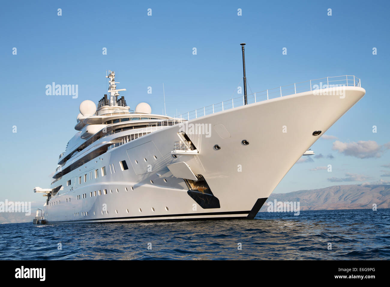 Gigantic big and large luxury mega or super motor yacht on the blue ...